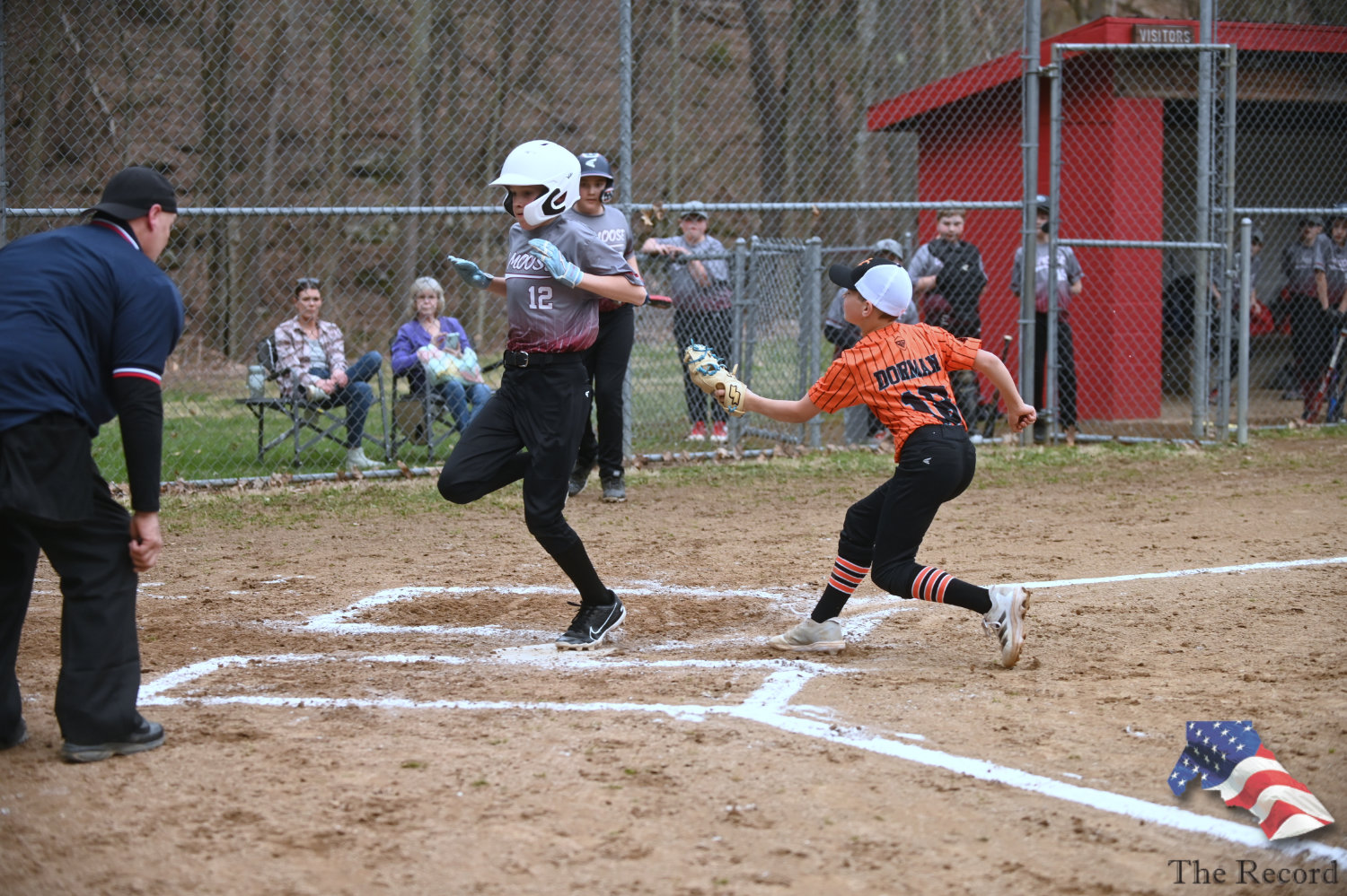 Lucas Brant scoring as Max Dorman goes for the tag – The Record Online